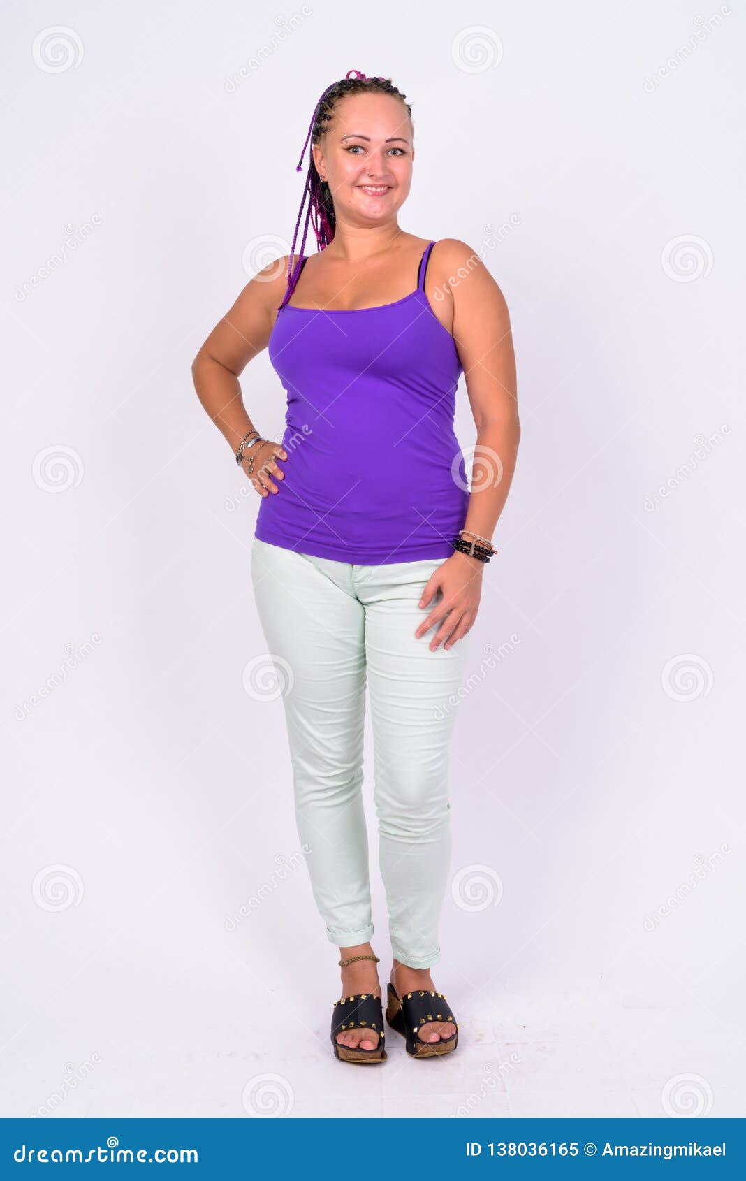 Full Body Shot Of Happy Rebellious Woman With Dreadlocks Smiling Stock