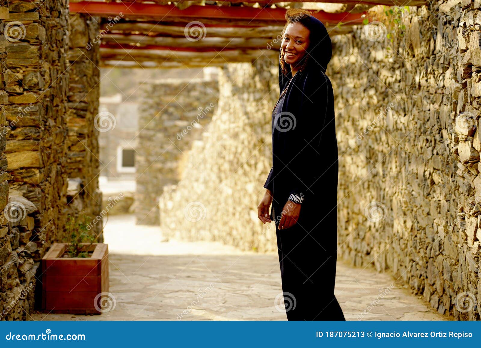 Full Body Smiling Young Muslim Woman in Historical Old Village Stock ... Full Body Smiling Young Muslim Woman in Historical Old Village Stock ...