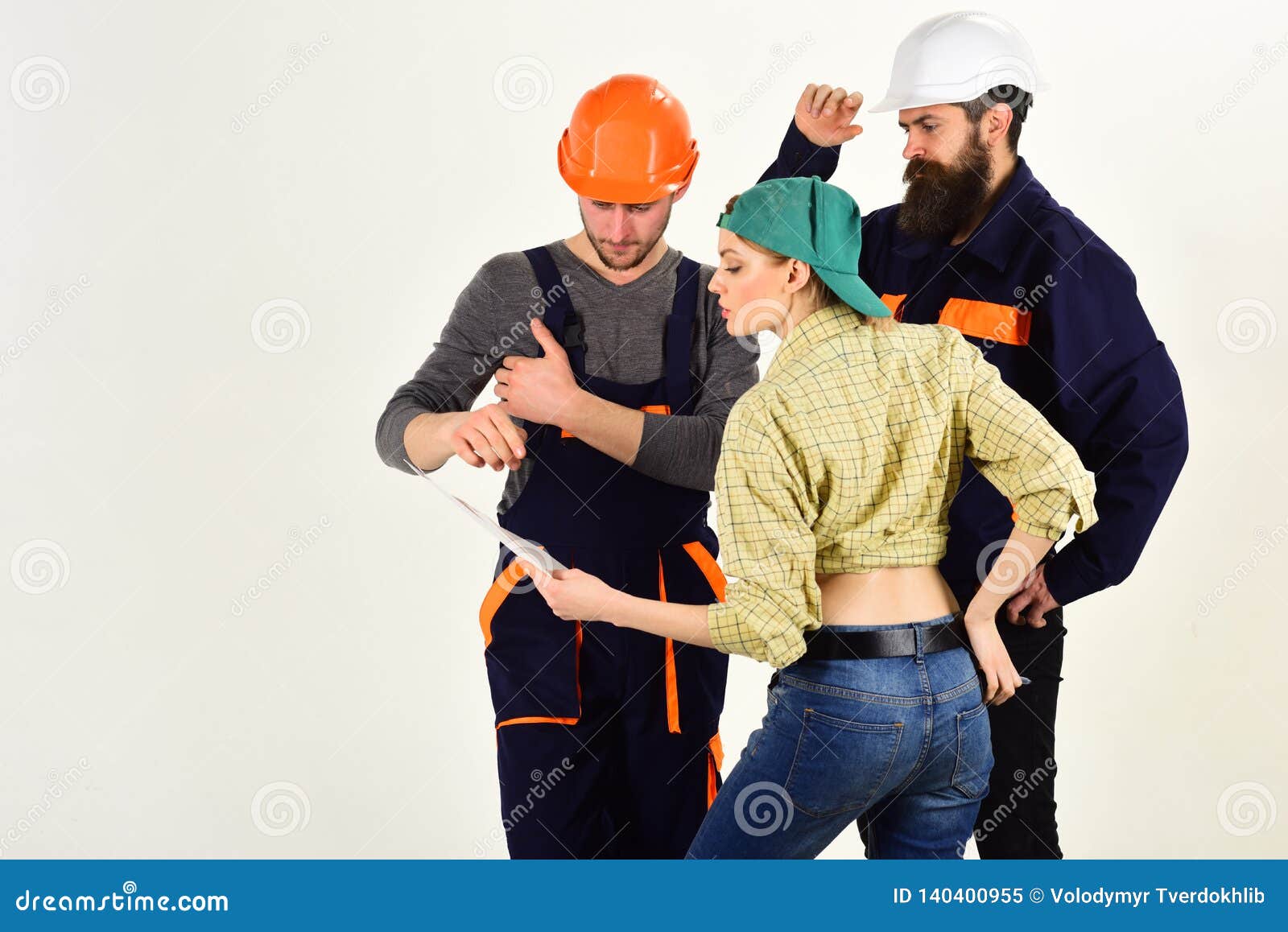 Full Concentration at Work. Men and Woman Builders Working in Team ...