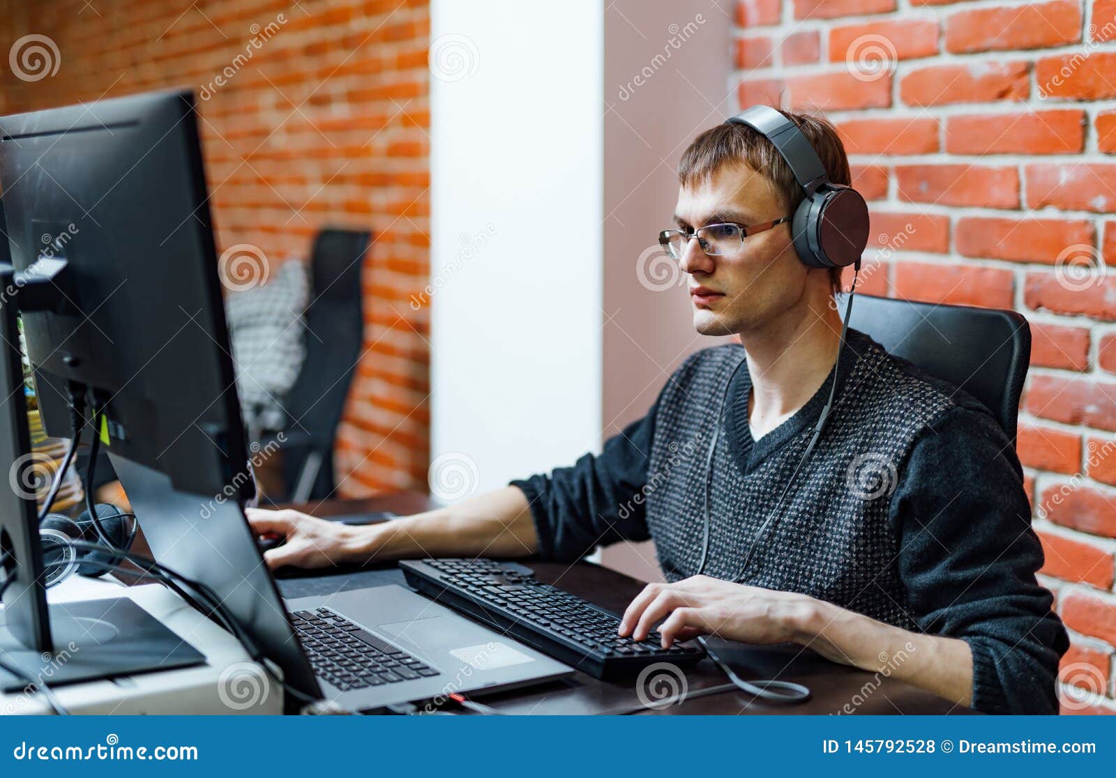 Full Concentration at Work. Young Employee Looking at Computer Monitor ...