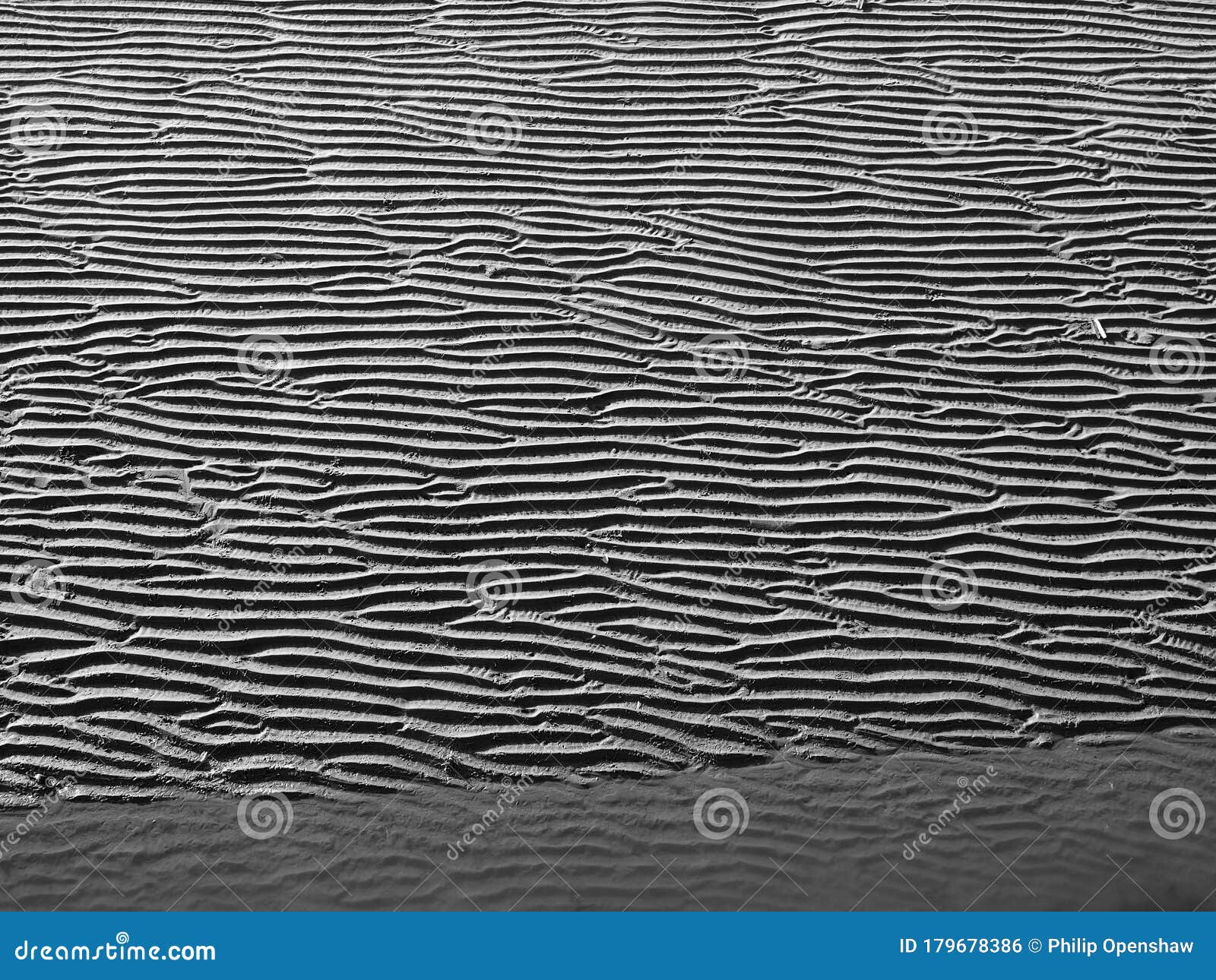 Full Frame Grey Beach Background with Wavy Pattered Surface and Water ...