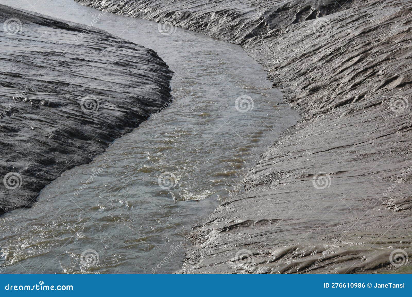 Full Frame Image of Mud Flat with Small River Running through Stock ...