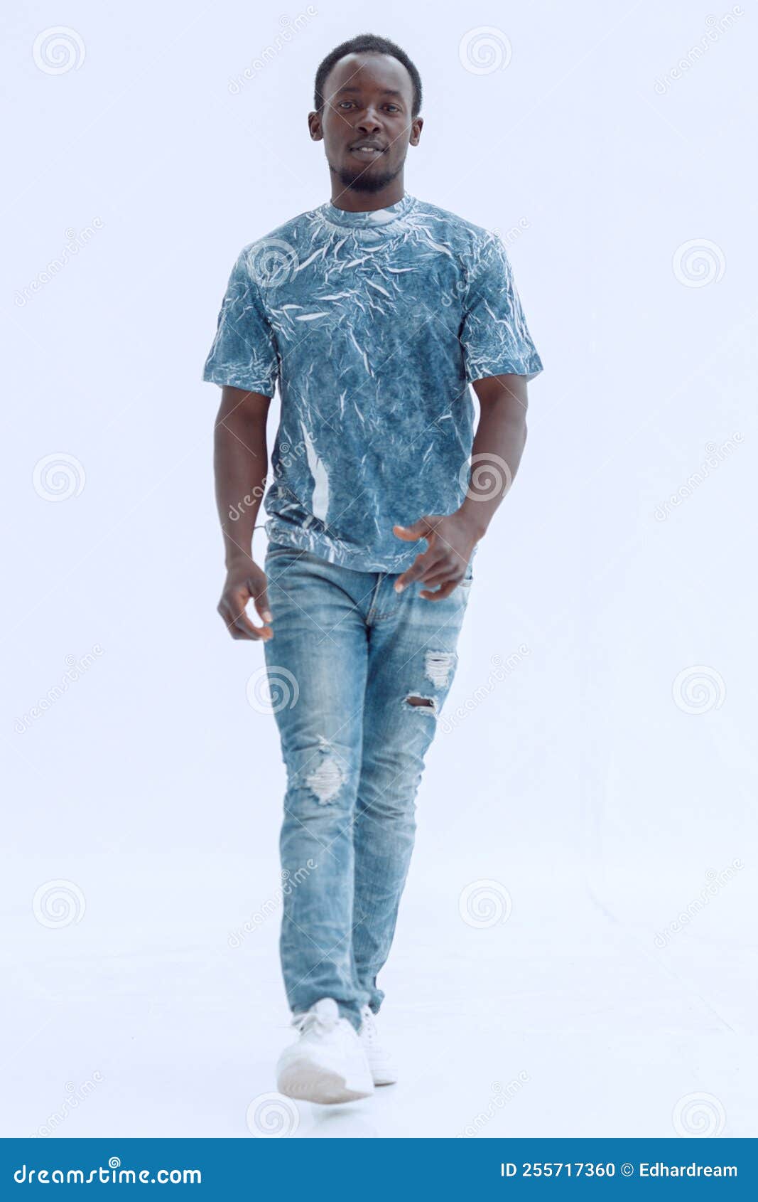 In Full Growth. Casual Young Man Confidently Striding Forward Stock ...