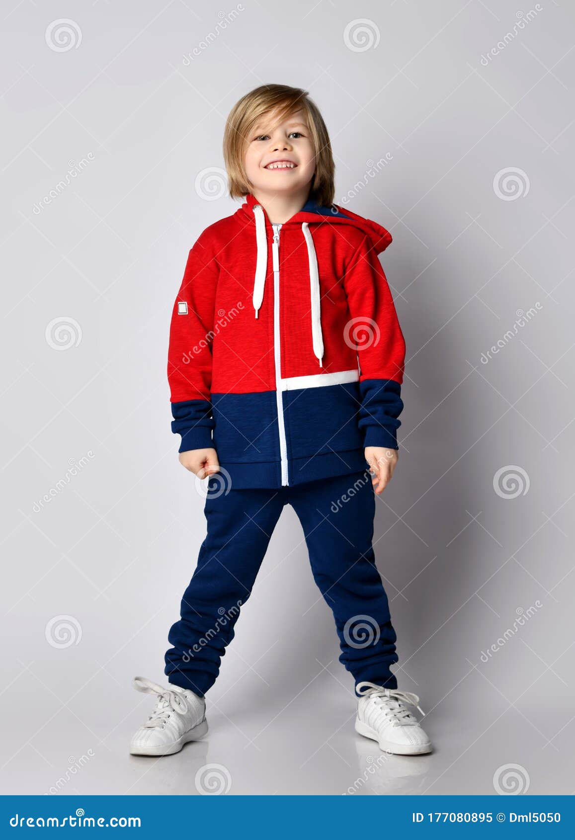 Full Growth Portrait of Happy Smiling Blond Kid Boy in Red and Blue ... Full Growth Portrait of Happy Smiling Blond Kid Boy in Red and Blue ...
