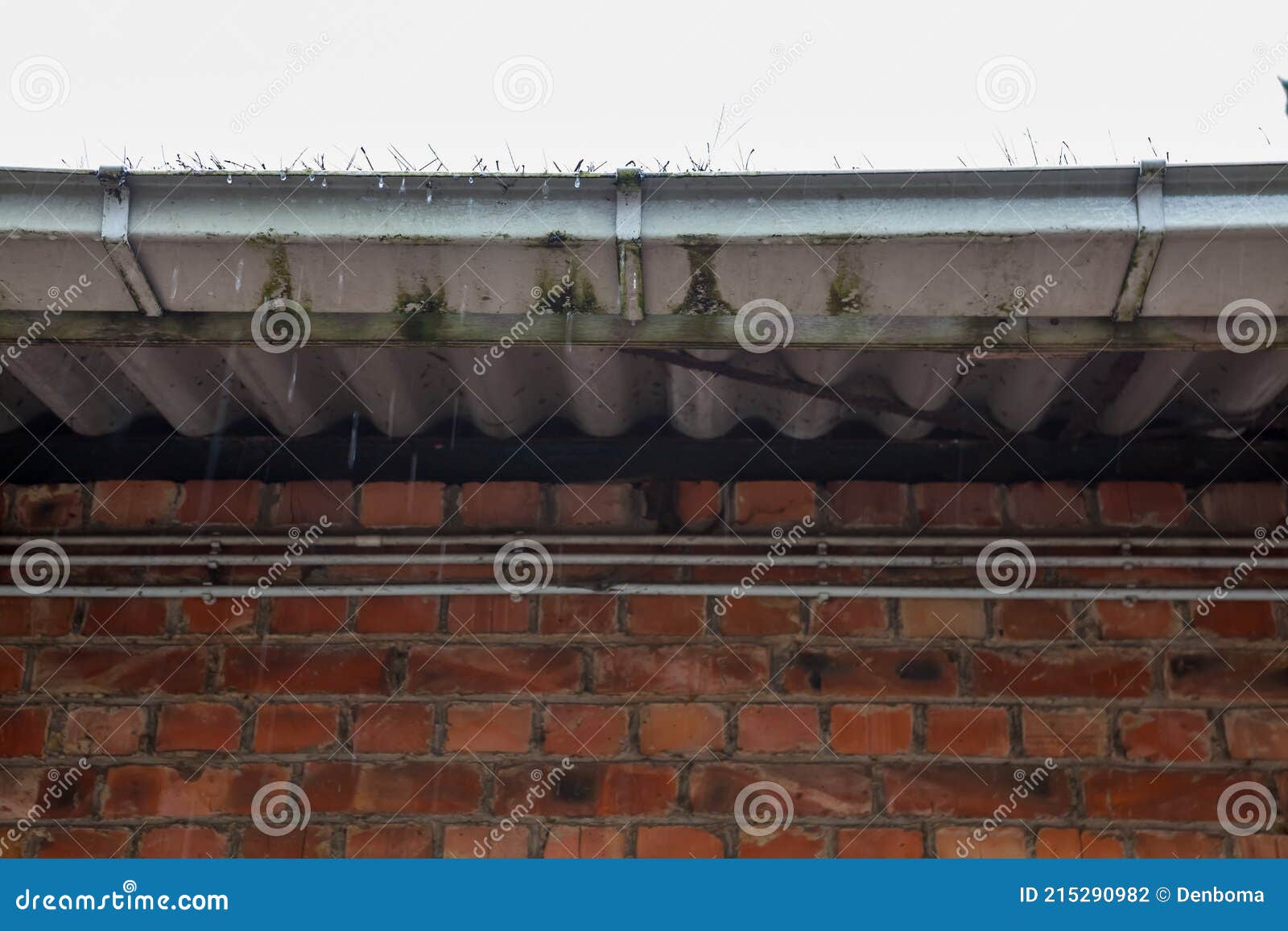 A full leaking gutter stock photo. Image of architecture - 215290982