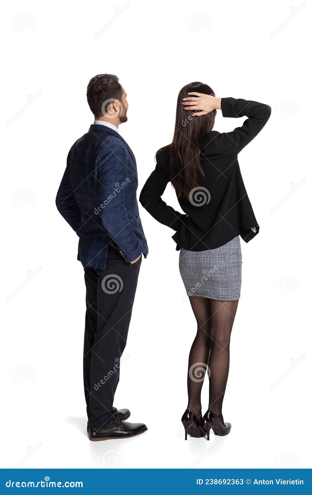 Full-length Back View Portrait of Two Office Workers Looking on Board ...