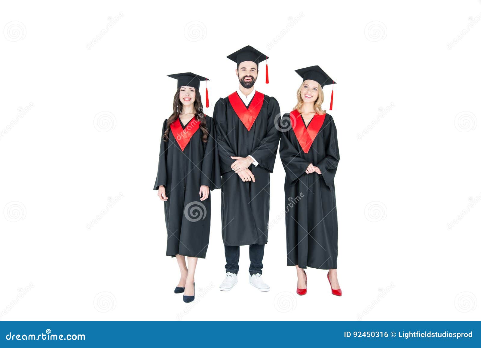 Full Length Front View of Happy Students in Graduation Caps Standing ...