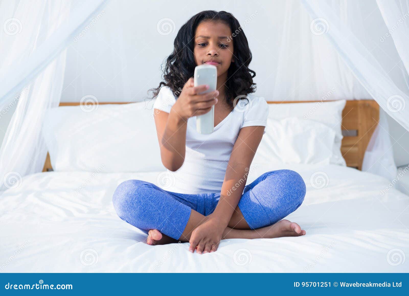 Full Length of Girl Holding Remote Control Stock Image - Image of blue ...