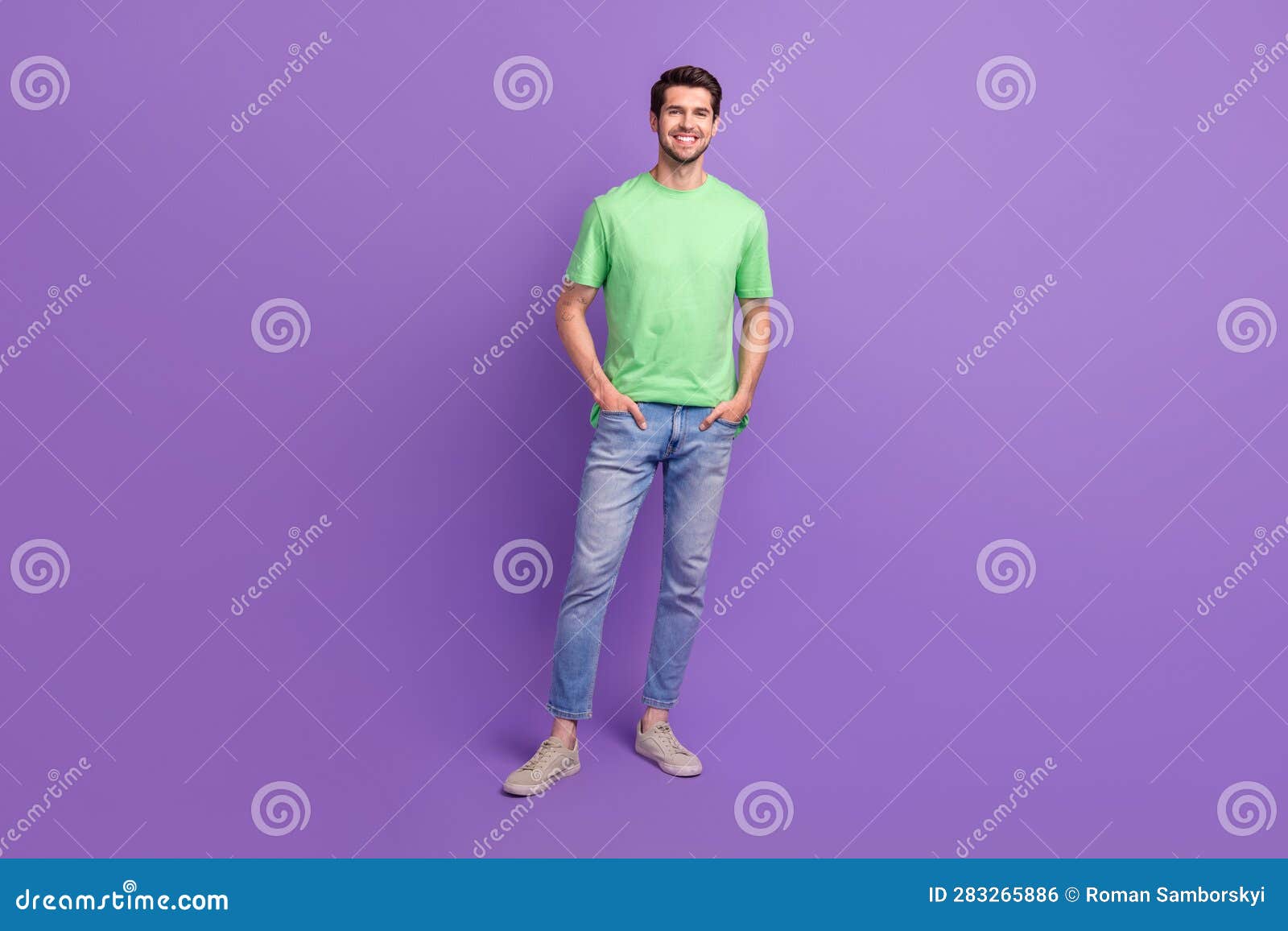 Full Length Photo Of Young Guy Wear Green T Shirt Jeans Denim Sneakers Stylish Outfit