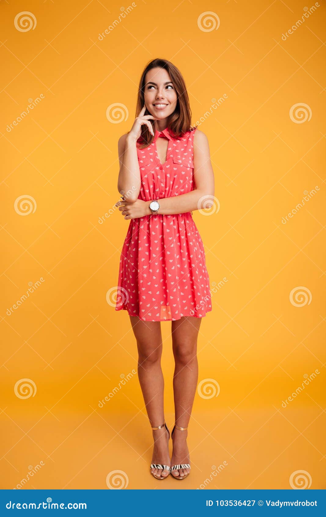 Full Length Portrait Of Beautiful Girl In Red Dress Touching Her Stock