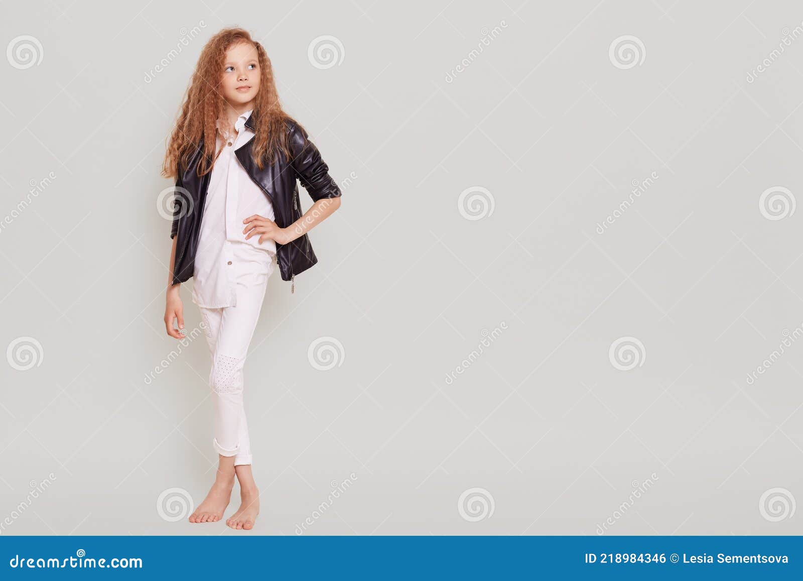 Full Length Portrait of Confident Little Schoolgirl Wearing White ... Full Length Portrait of Confident Little Schoolgirl Wearing White ...