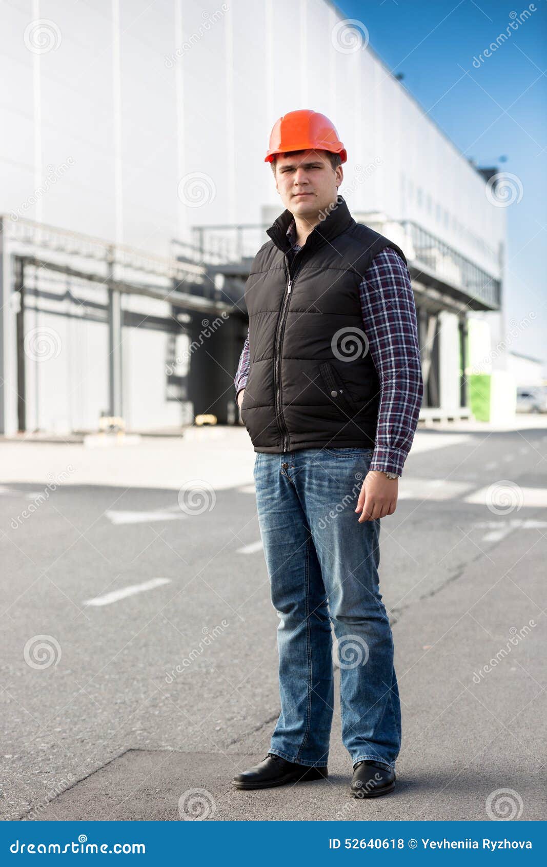 Full Length Portrait of Engineer Posing Against Big Warehouse Stock ...