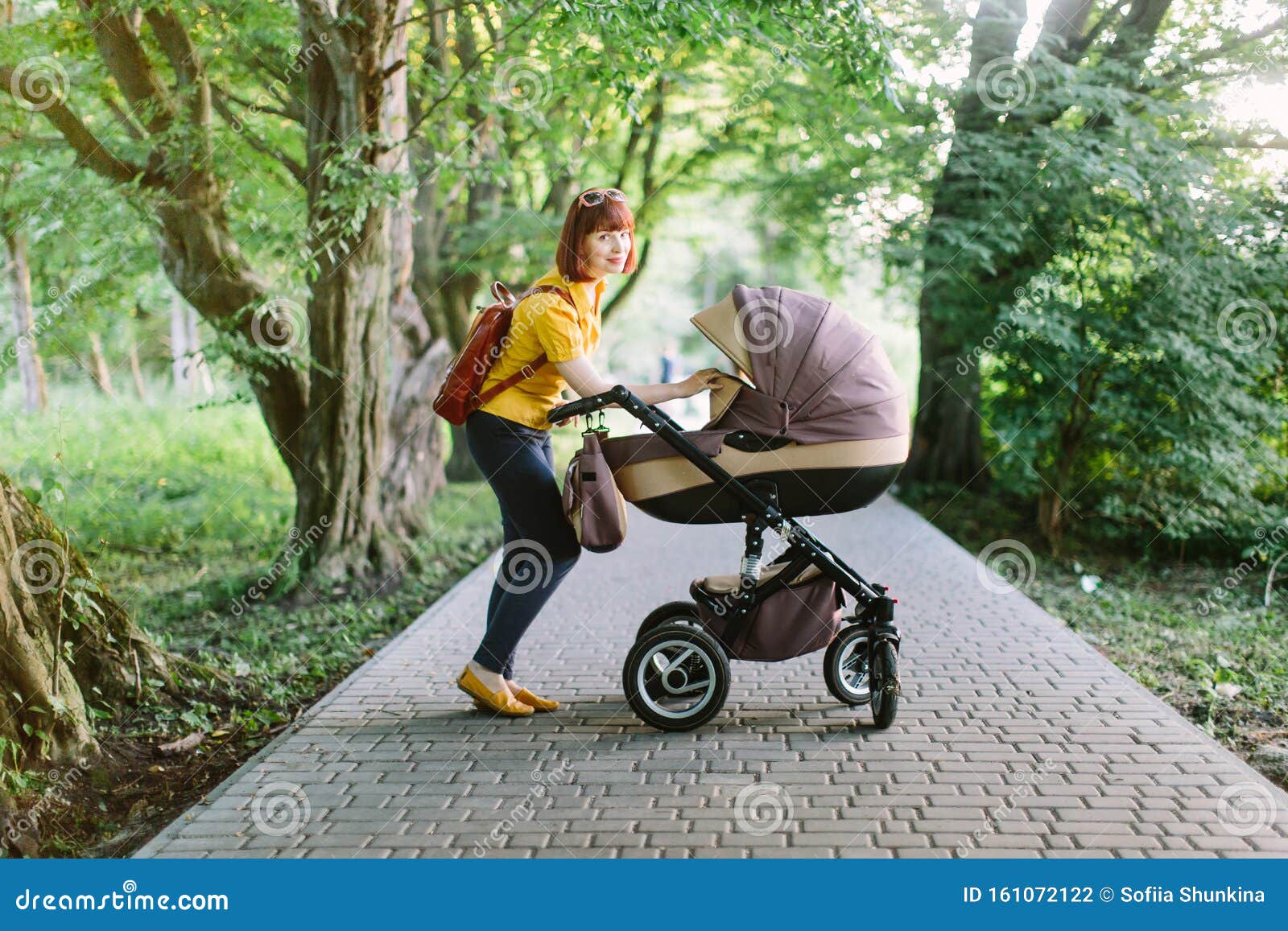 Full Length Portrait of a Mother with a Stroller. Young Mom Stock Photo ...