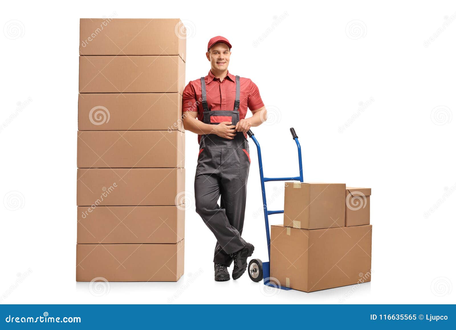 Mover with a Hand Truck Leaning on a Stack of Boxes and Smiling Stock ...