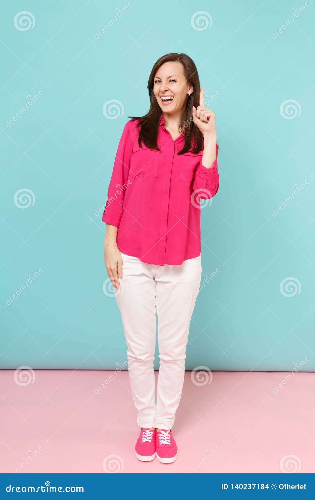 Full Length Portrait Of Smiling Young Pretty Woman In Rose Shirt Blouse