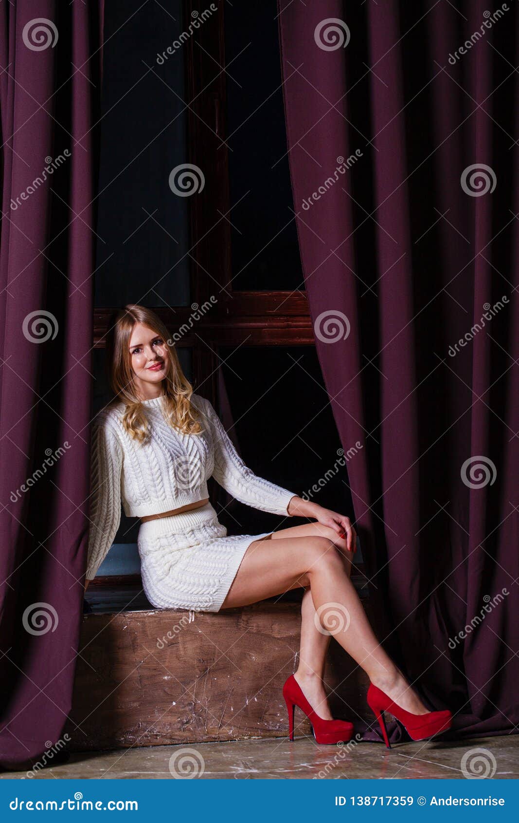 Full Length Portrait of Young Beautiful Blonde Woman in a White Knitted ... Full Length Portrait of Young Beautiful Blonde Woman in a White Knitted ...