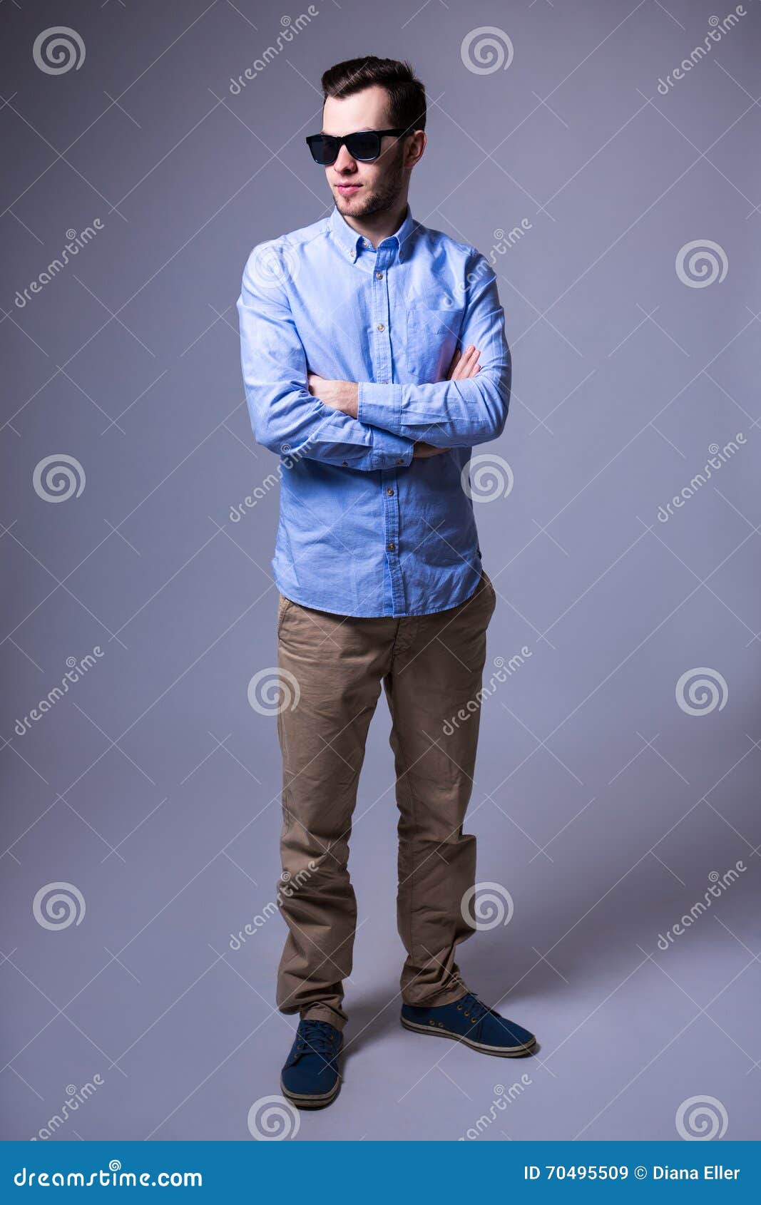 Full Length Portrait Of Young Handsome Man In Sunglasses Posing Stock