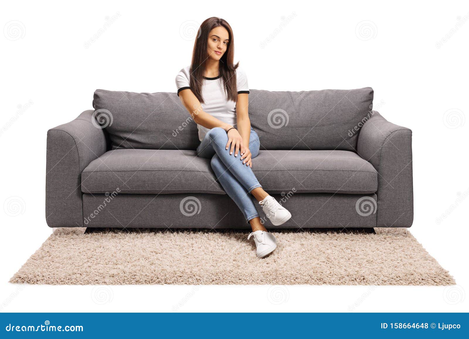 Young Woman Sitting on a Gray Sofa Stock Photo - Image of comfortable ... Young Woman Sitting on a Gray Sofa Stock Photo - Image of comfortable ...