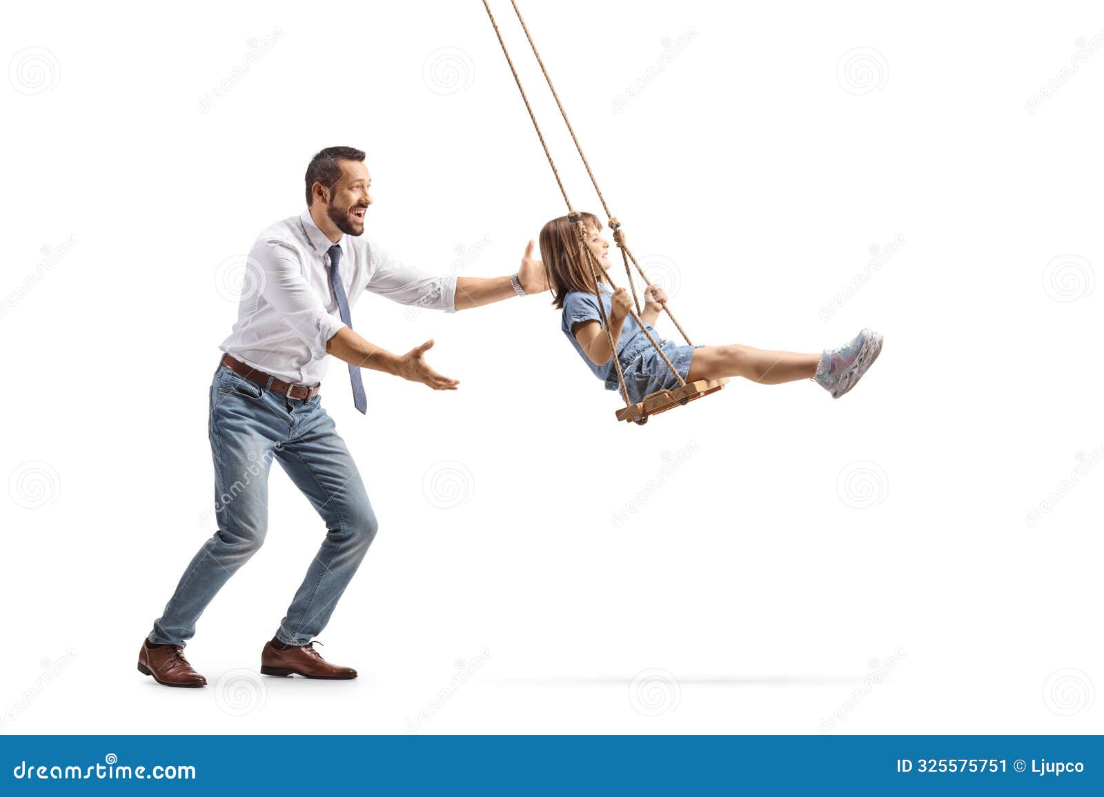Full Length Profile Shot of a Man Pushing a Kid on a Swing Stock Image ...