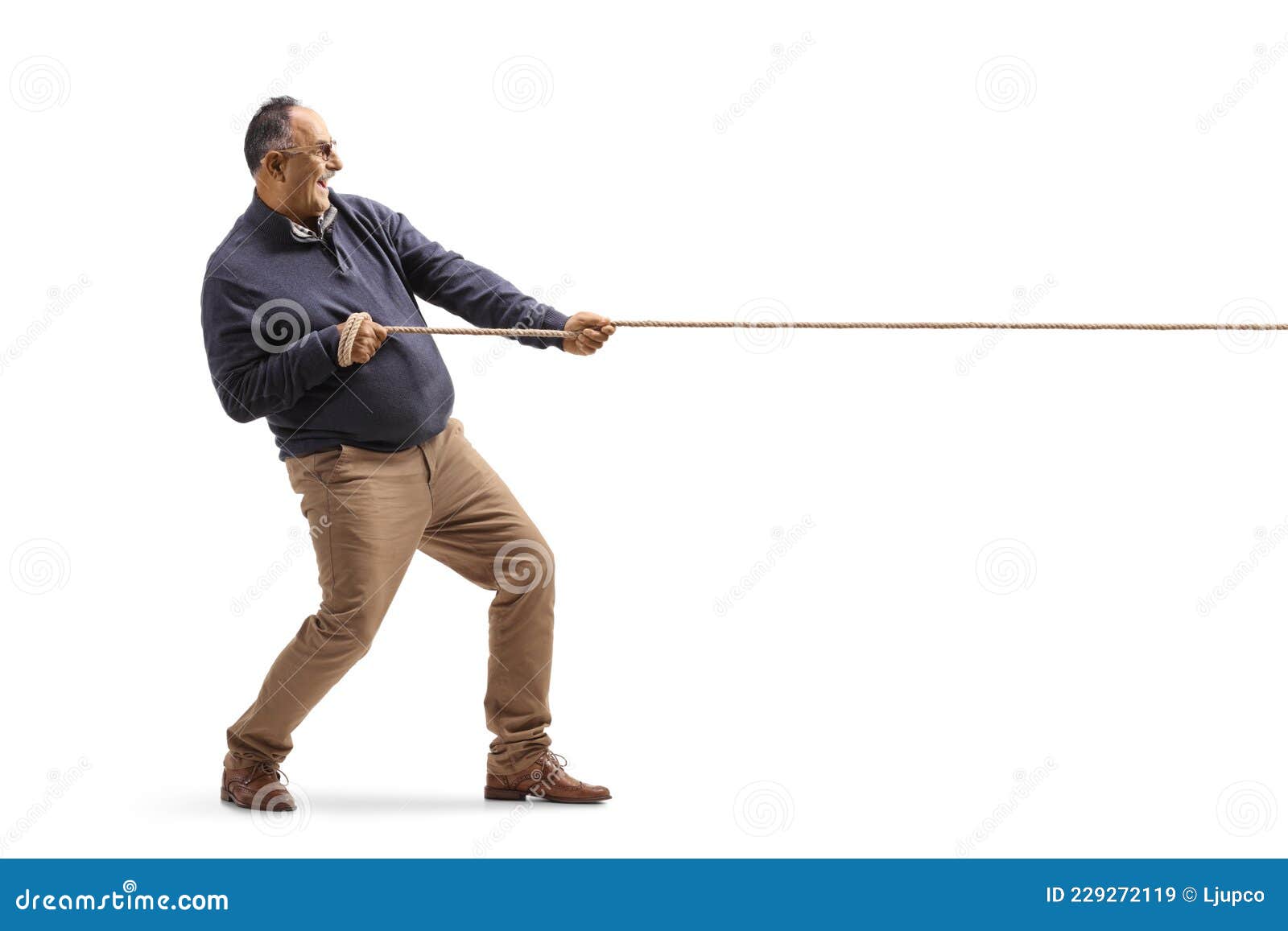 Full Length Profile Shot of a Mature Man Pulling a Rope Stock Image ...