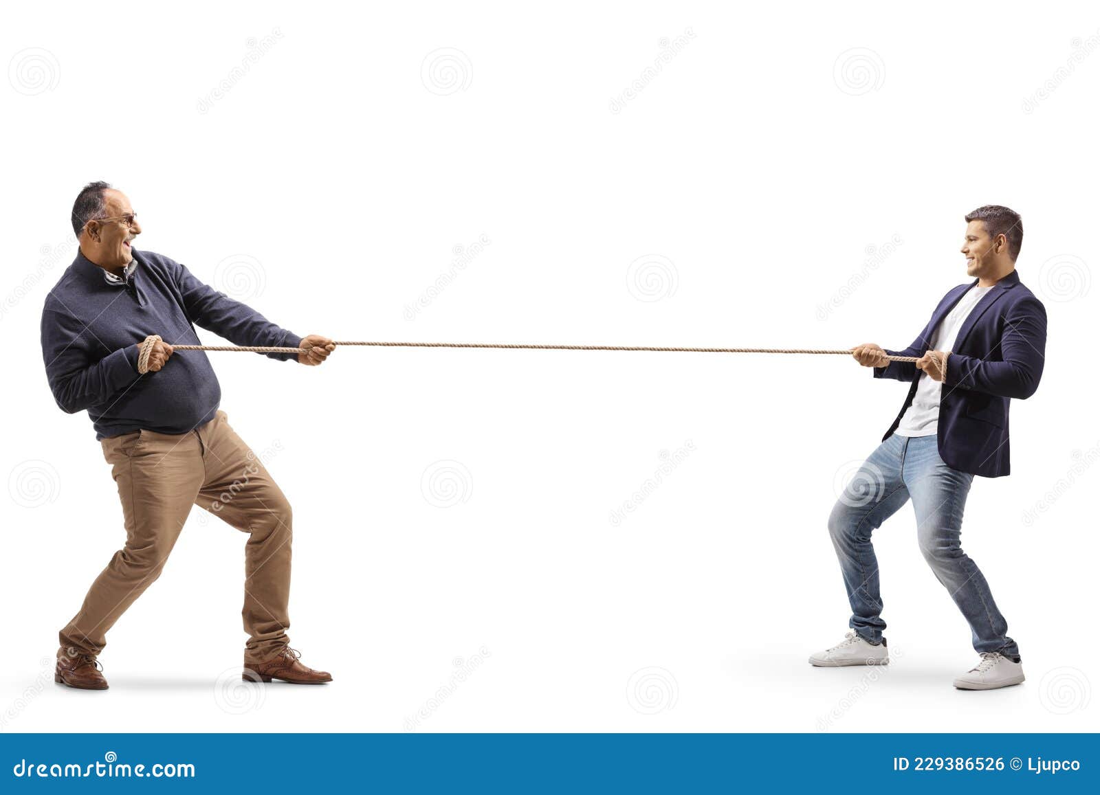 Full Length Profile Shot of a a Mature Man and a Young Man Pulling a ...