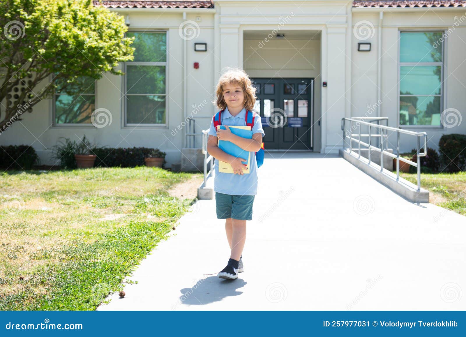 Full Length Schoolboy with Backpack Near Building Outdoors. Beginning ...