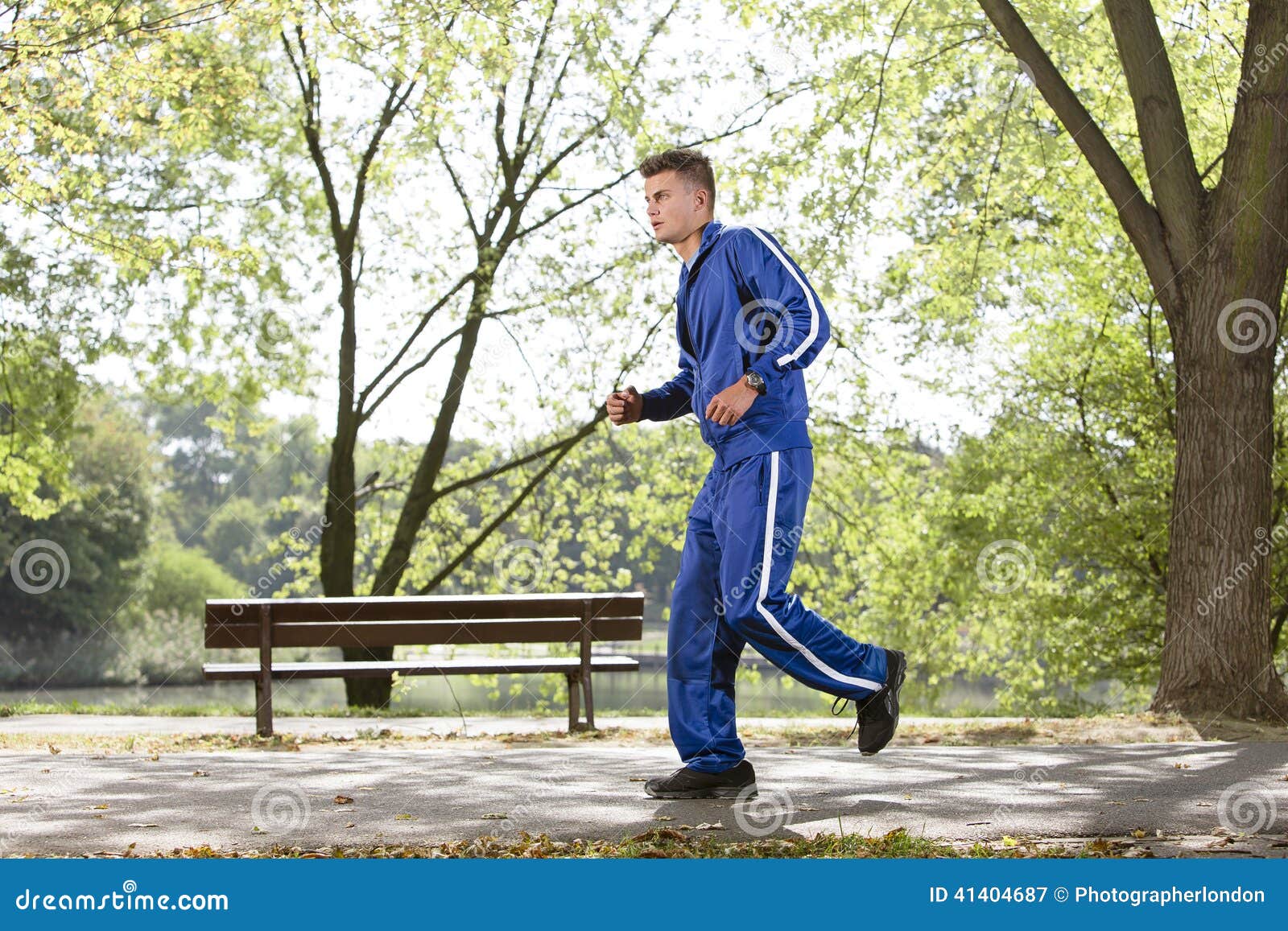 Full Length Side View of Man Jogging on Path in Park Stock Image ...