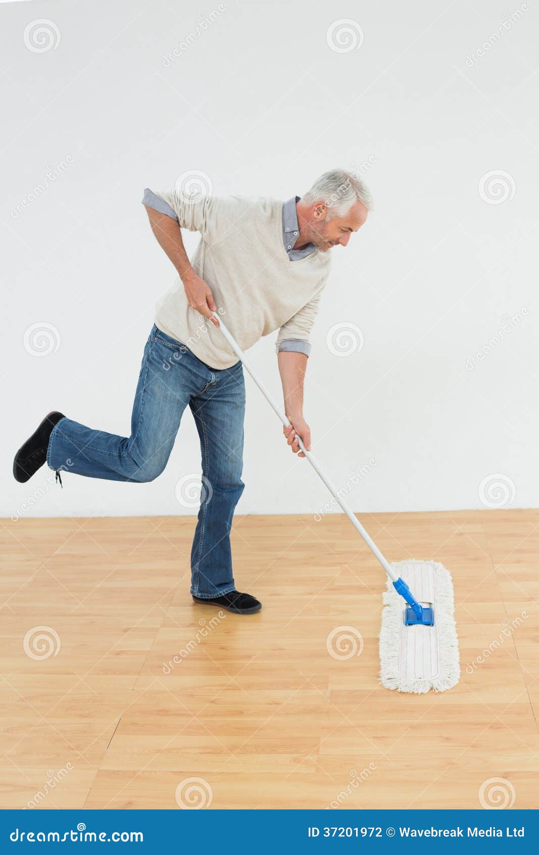 Full Length Side View of a Mature Man Mopping the Floor Stock Photo ...