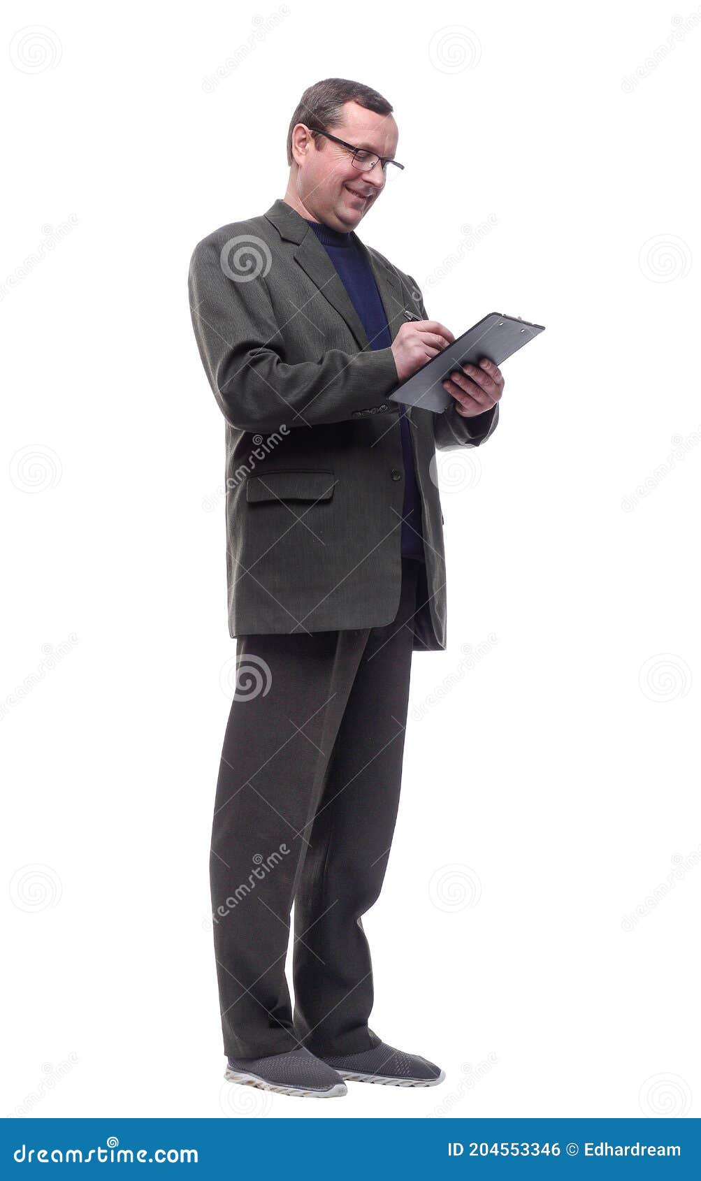Full Length . Smiling Man Taking Notes in the Clipboard Stock Photo ...