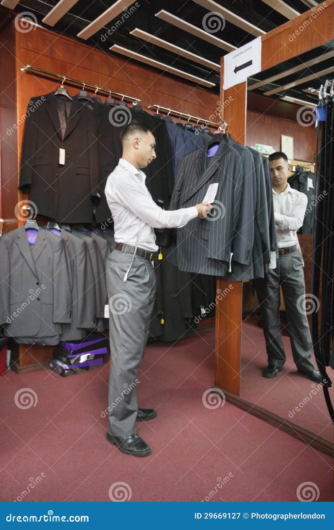 Full-length of Tailor Standing by the Clothing Rack of Suits Stock ...