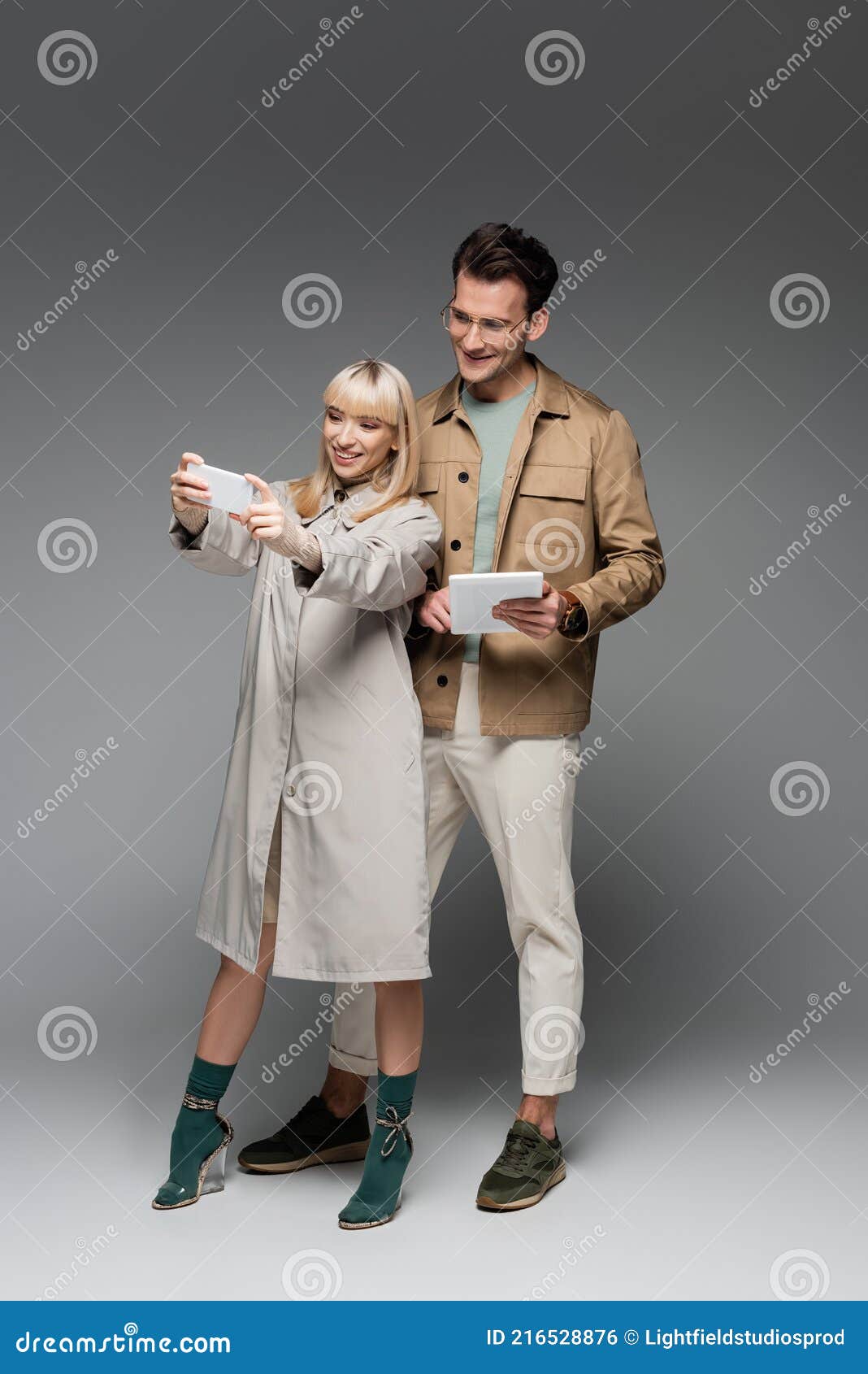 Full Length of Trendy Models Posing Stock Photo - Image of gray, couple ...