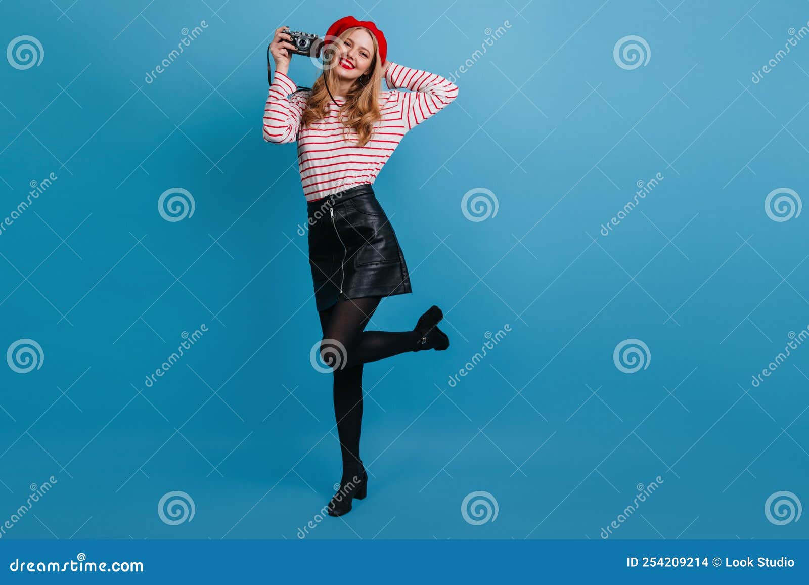 Full Length View Of Stunning French Girl With Camera Blonde Slim Woman In Beret Dancing On Blue