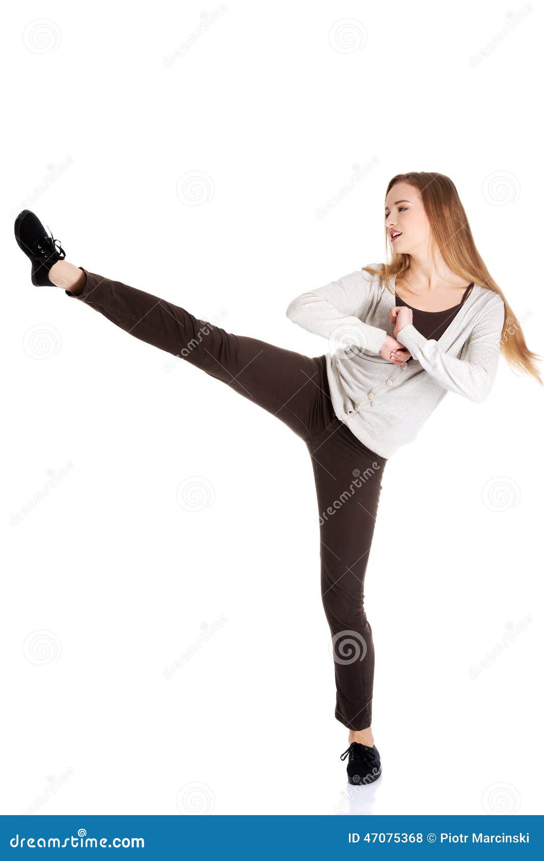 Full length woman kicking stock photo. Image of adult - 47075368