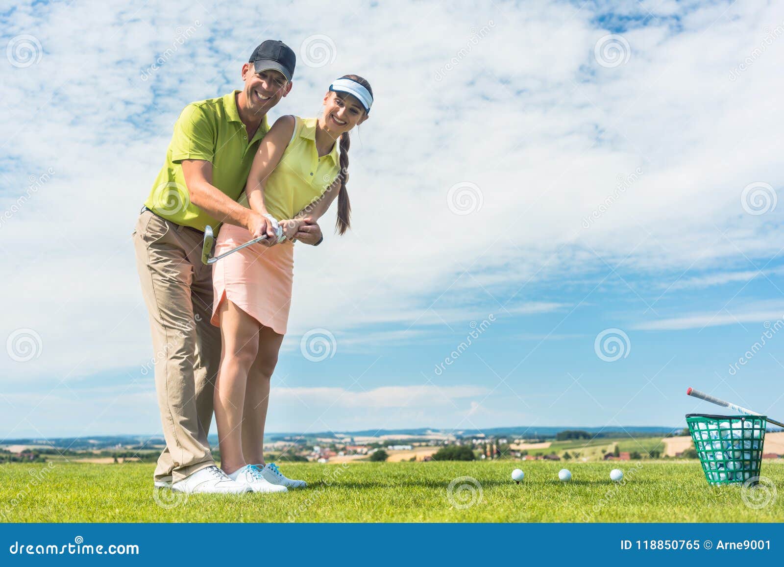 Young Woman Practicing the Correct Move during Golf Class with a ...