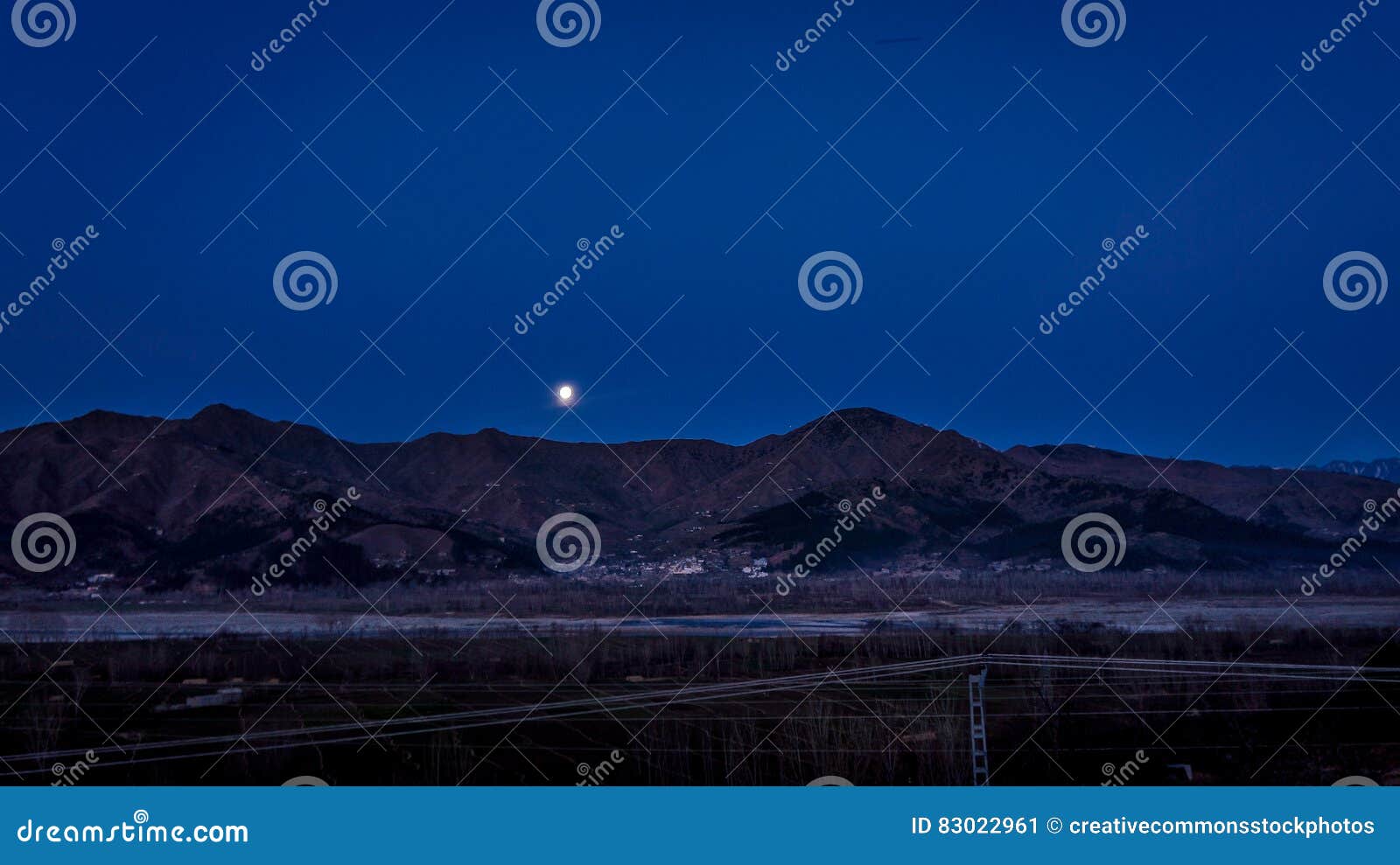 Full Moon Above the Mountain Ranges Near Town Stock Image - Image of ...