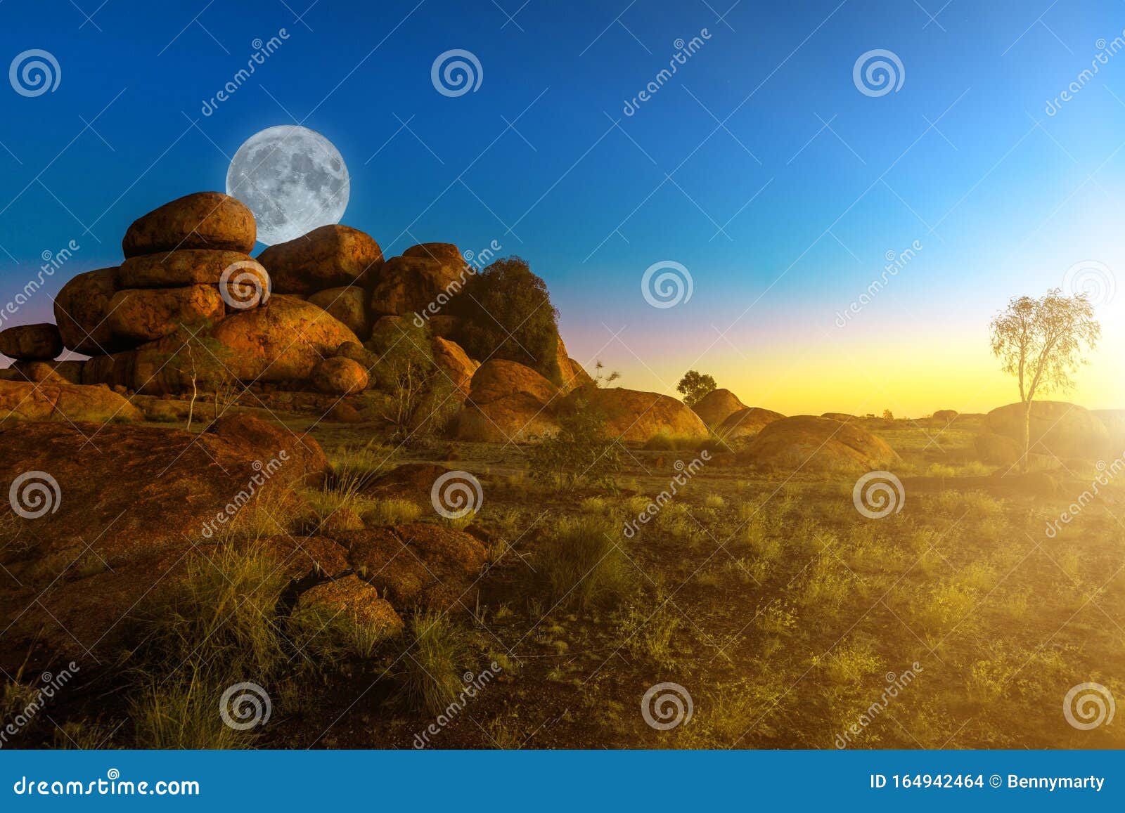 Devils Marbles with moon stock photo. Image of karlu - 164942464