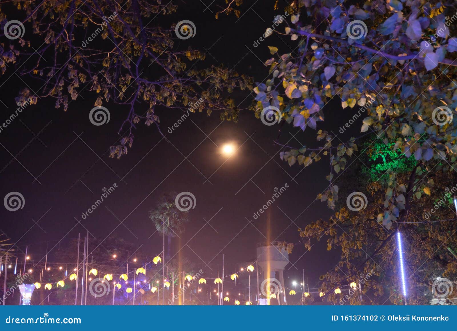 A Full Moon Emits Light in the Night Sky. Moonlight Shines through the ...