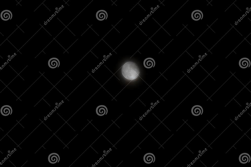 Almost Full Moon Framed in the Center of the Frame with a Slight Cloud ...