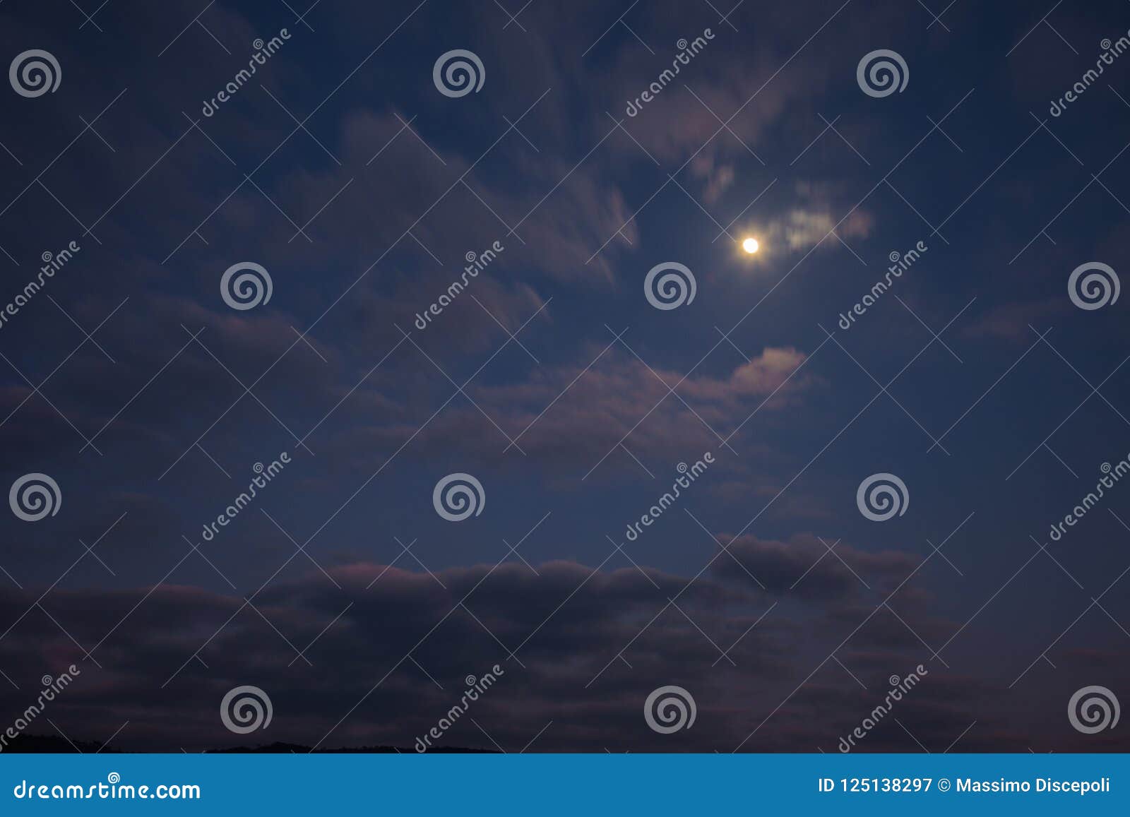 Full Moon in the Middle of Warm Coloured Clouds at Dusk Stock Image ...