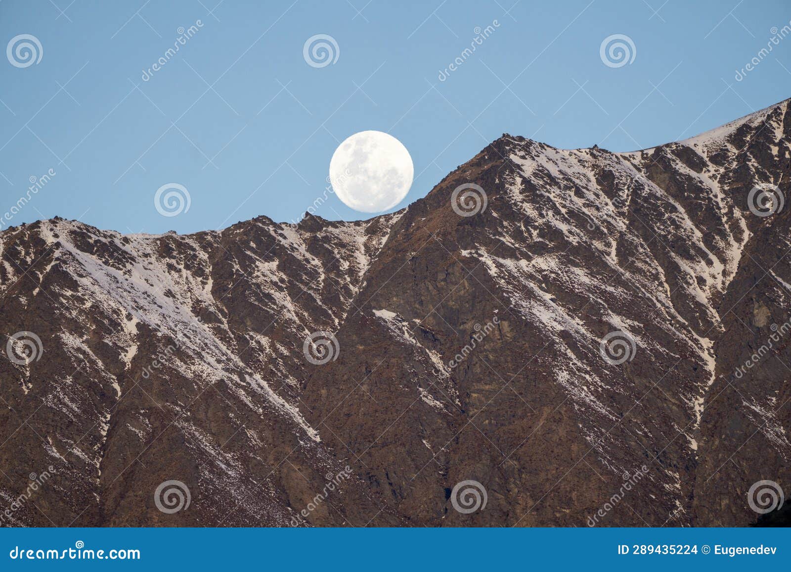 Full Moon Rise Over the Mountains on the Blue Sky Background Stock ...