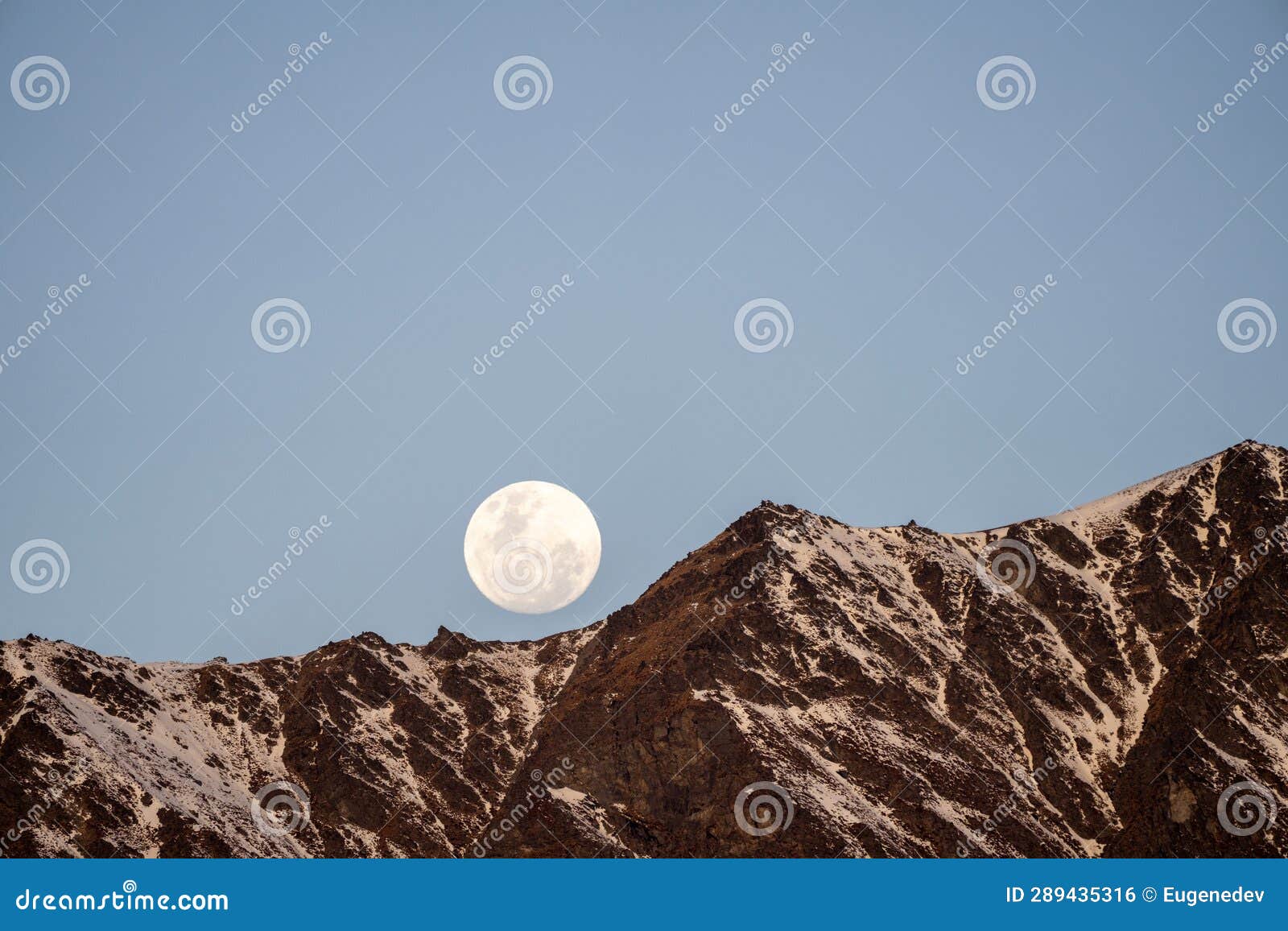 Full Moon Rise Over the Mountains on the Blue Sky Background Stock ...