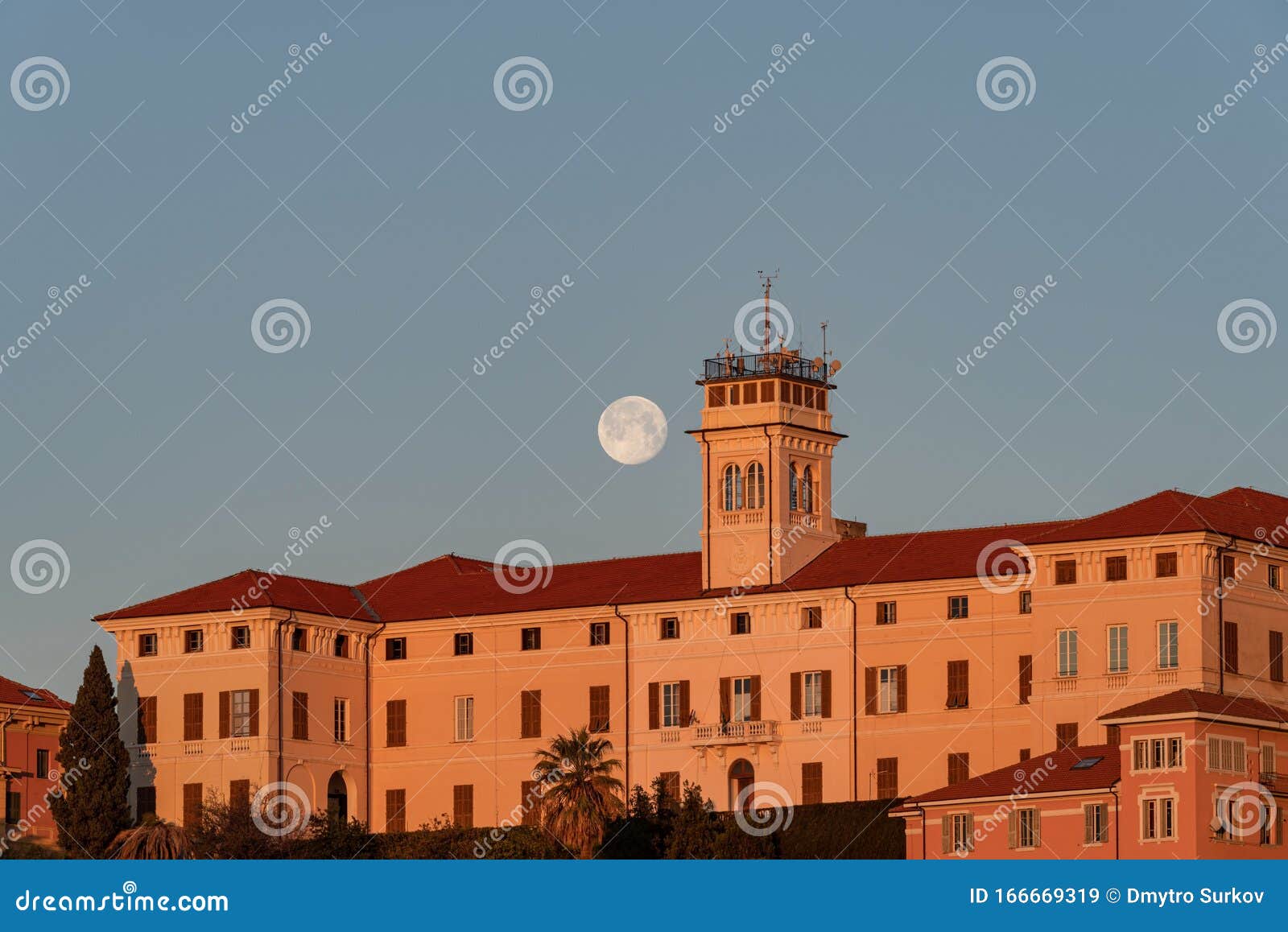 Full Moon Setting at Sunrise Stock Image - Image of moonset, building ...