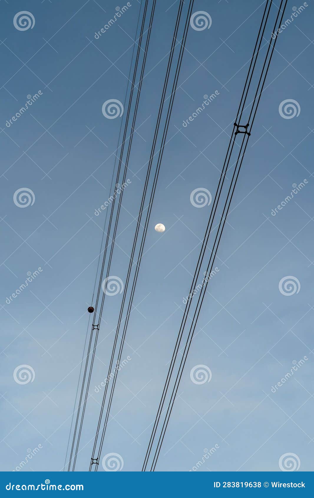 A Full Moon with Some Power Lines in the Sky and Trees Stock Photo ...