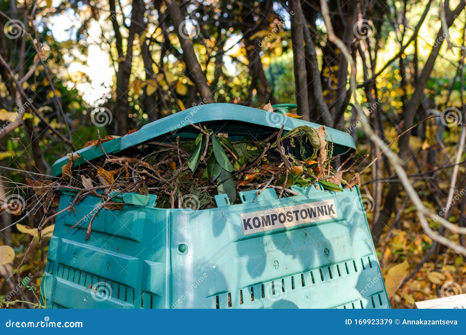 Full Outside Plastic Compost Container With Leaves And Branches. Text ...