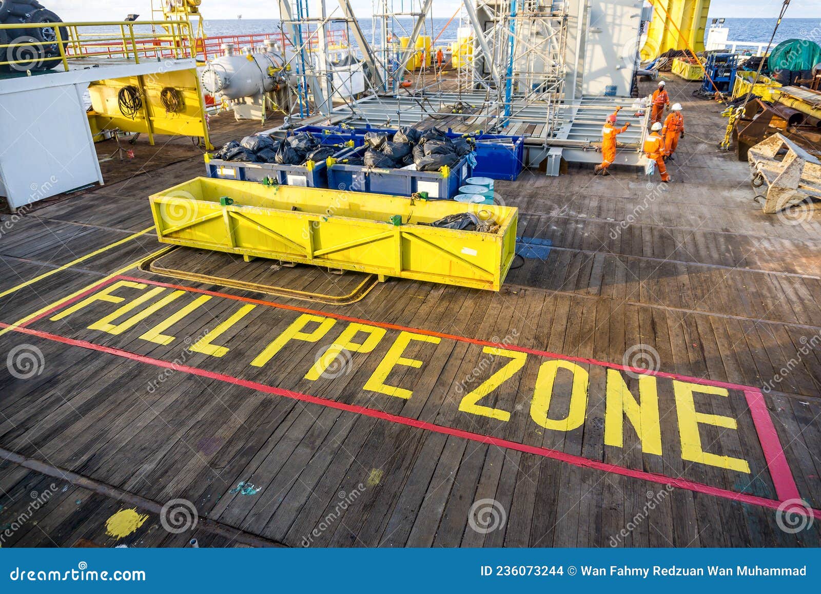 A Team of Rigger Lifting an Anchor from a Construction Work Barge Stock ...