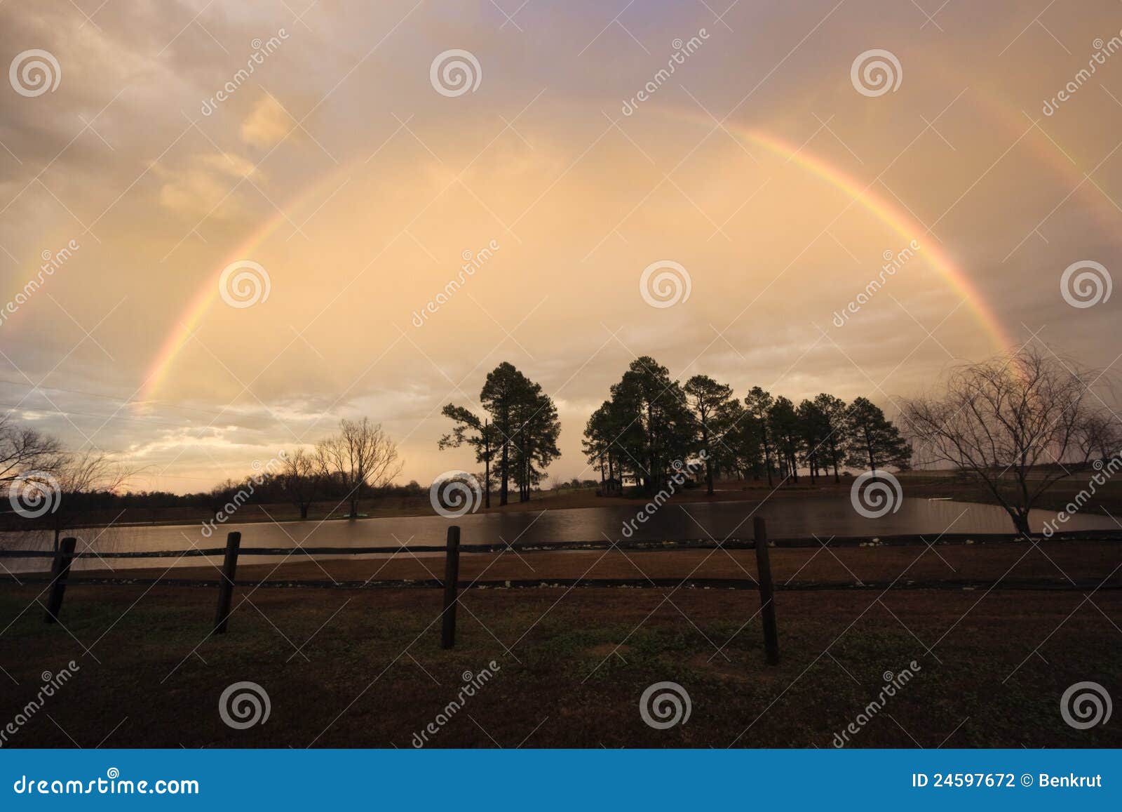 Full rainbow at sunset stock photo. Image of dusk, cloud - 24597672