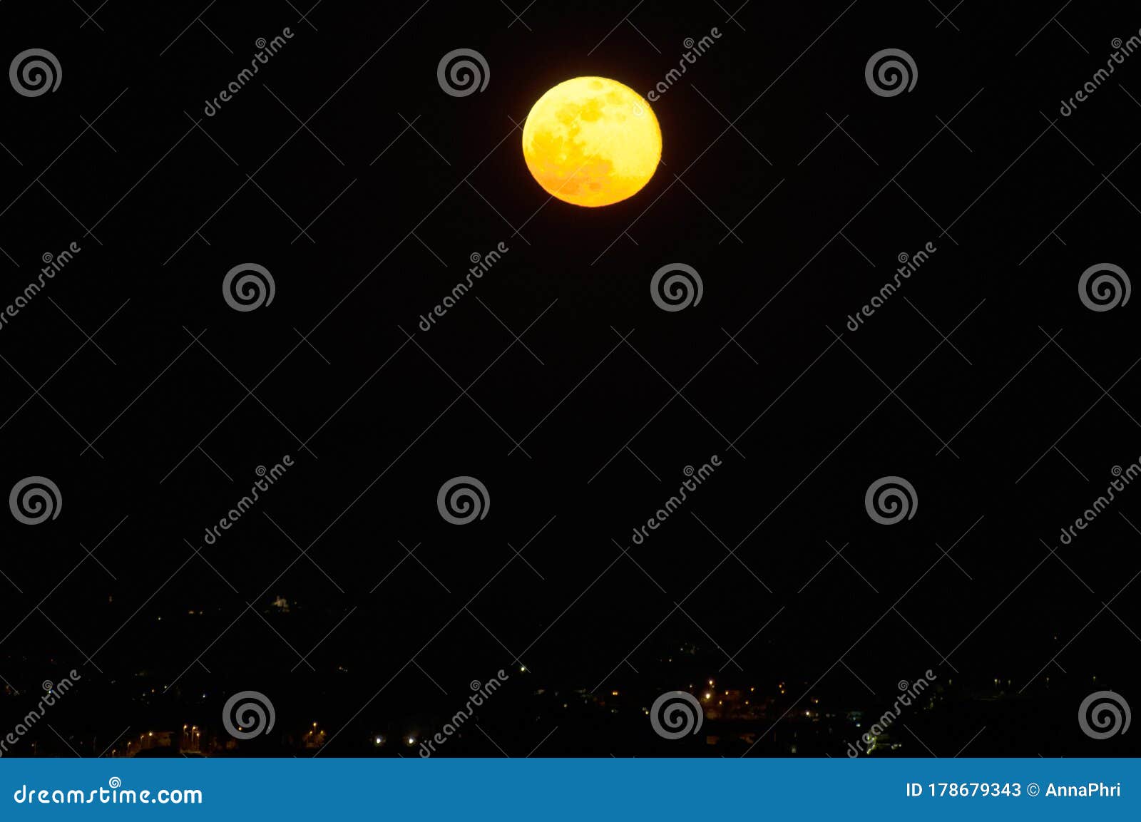 Full Red Moon in the Dark Sky and City Lights on the Bottom Stock Image ...