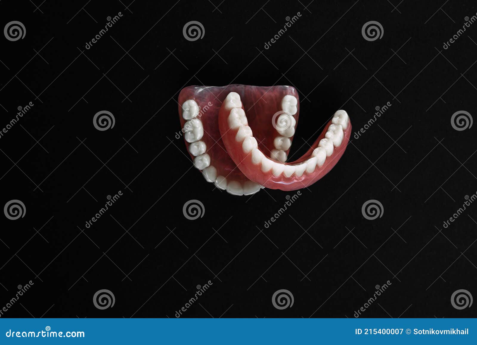Full Removable Plastic Denture of the Jaws. a Set of Dentures on a ...