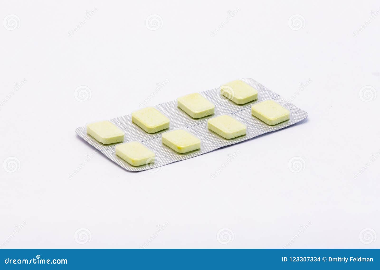 Full Sealed Packaging with Yellow Rectangular Tablets Lies on a White ...