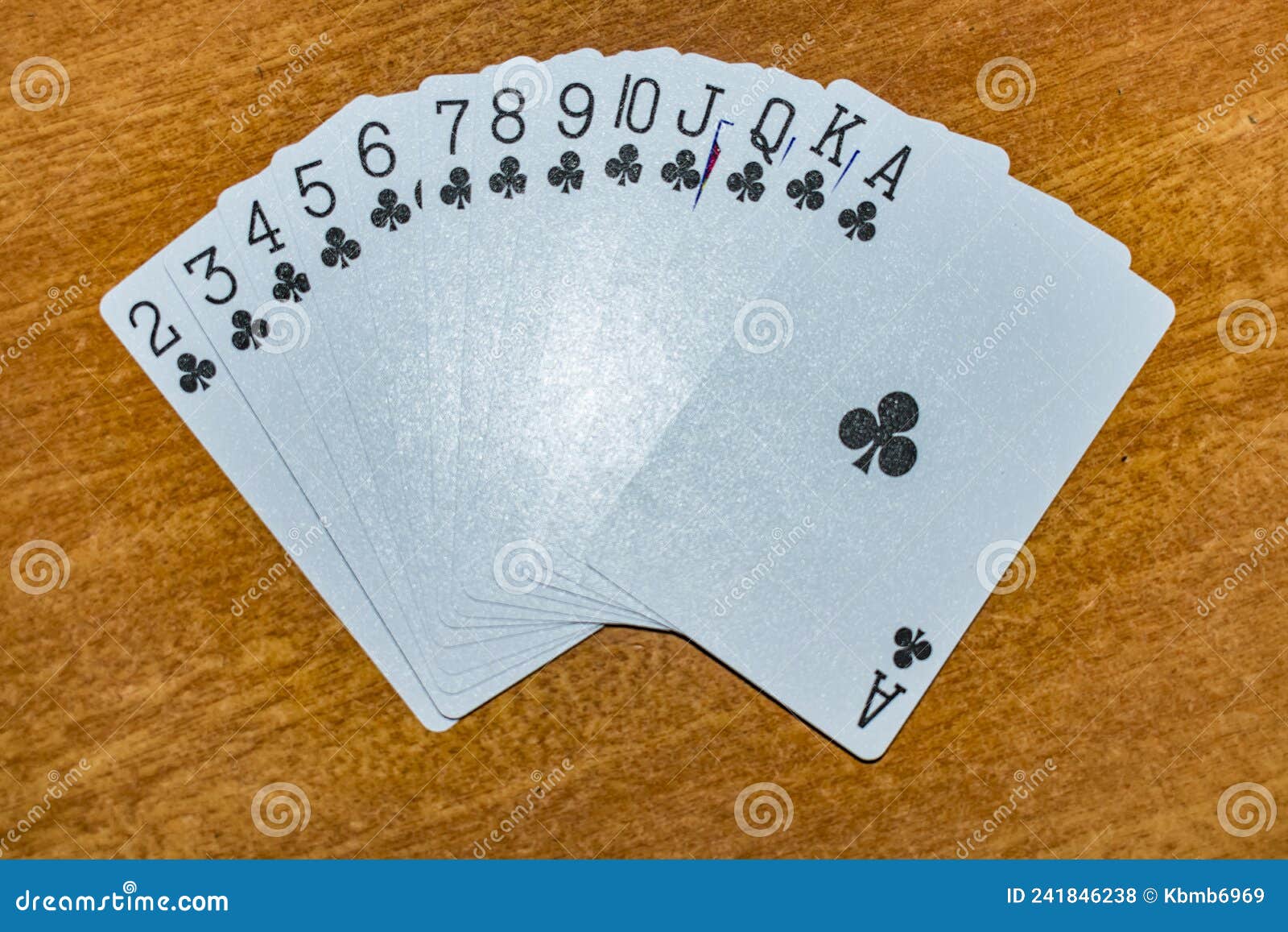 A Full Set of Clubs in Playing Card Laying on the Table with an ...